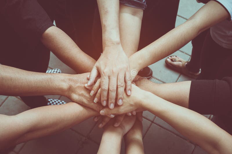 Many People Standing Hands Together in Field before Starting ...