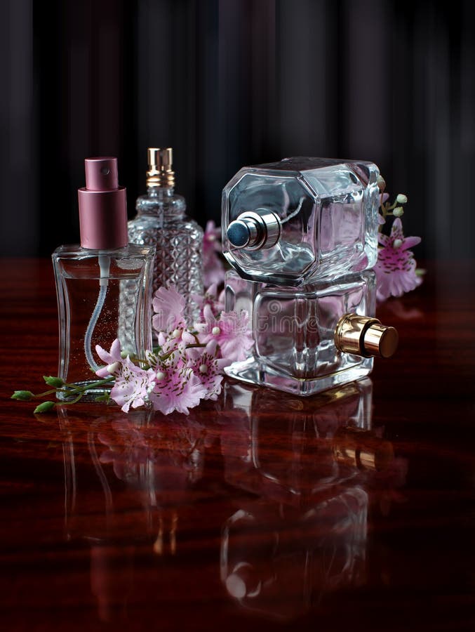Many Bottles of Perfume with White Flowers Stock Photo - Image of ...