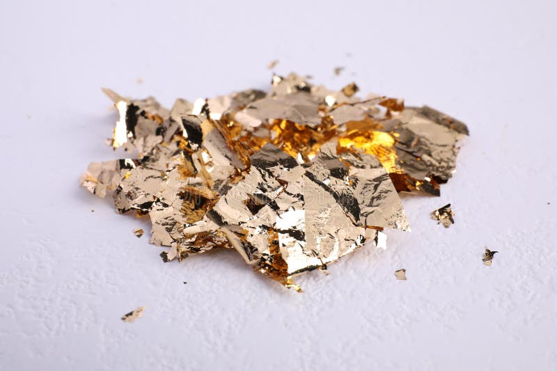 Pieces of Edible Gold Leaf on Wooden Table, Top View. Space for Text ...