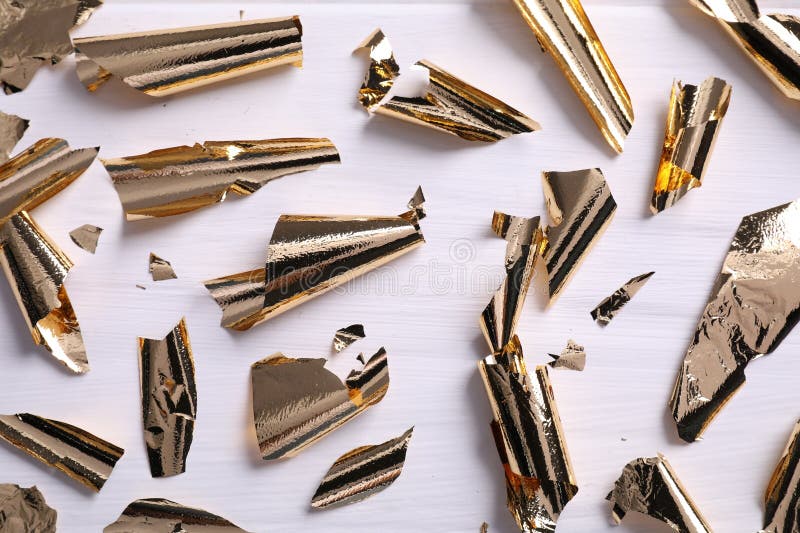 Many Pieces of Edible Gold Leaf on White Wooden Table, Flat Lay Stock ...