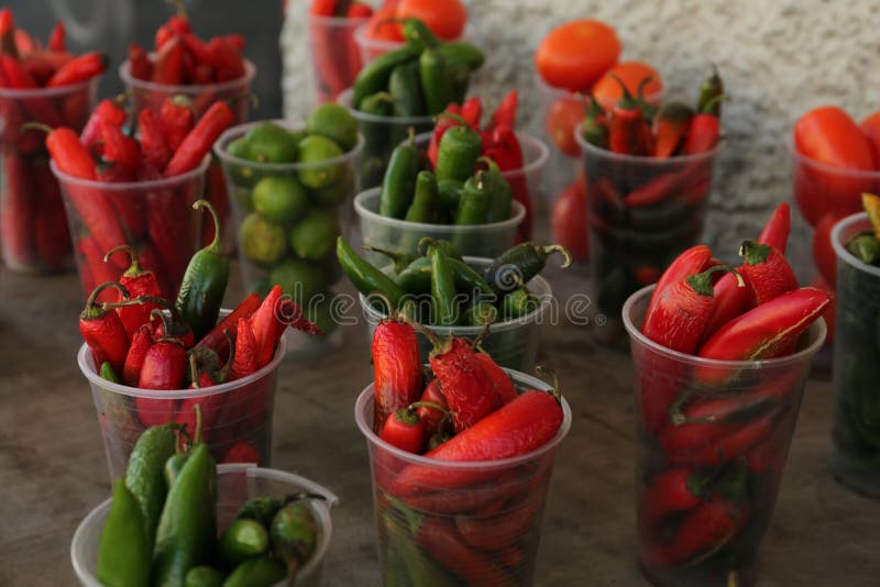 Many Plastic Cups with Fresh Chilli Peppers on Grey Counter at Market ...
