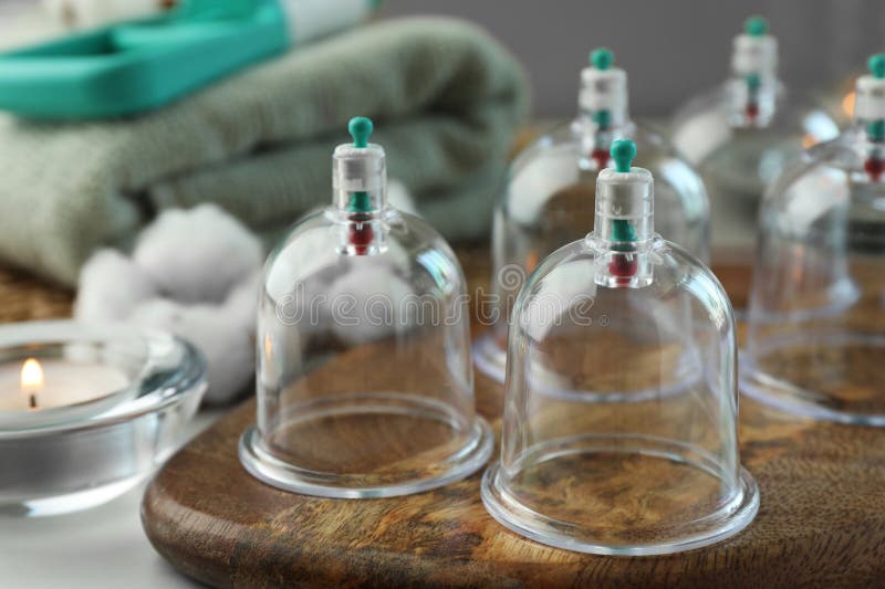 Many Plastic Cups on White Table, Closeup. Cupping Therapy Stock Image ...