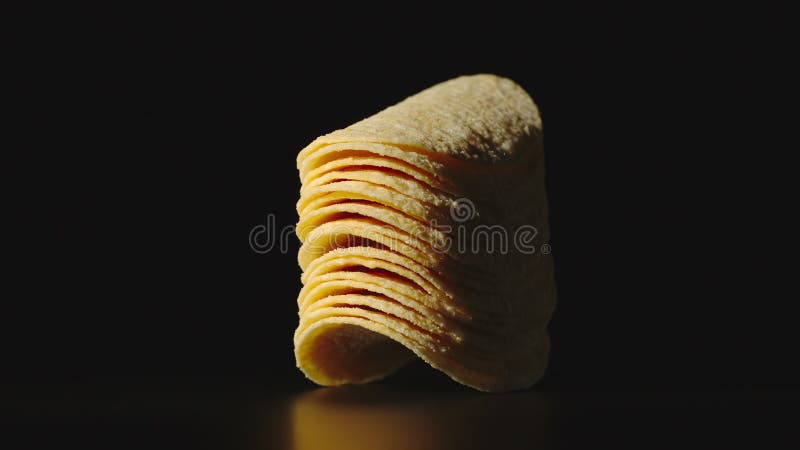 Many Potato Chips on a Black Surface Stock Image - Image of pyramid ...