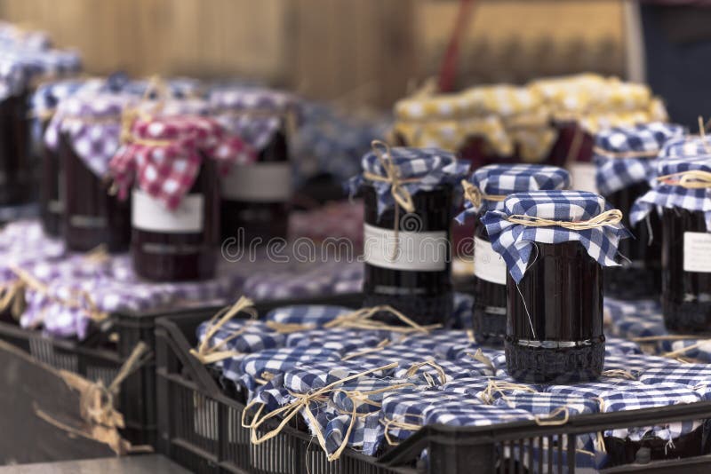 Many Preserving Jars with Dark Jam in a Market Stock Photo - Image of ...