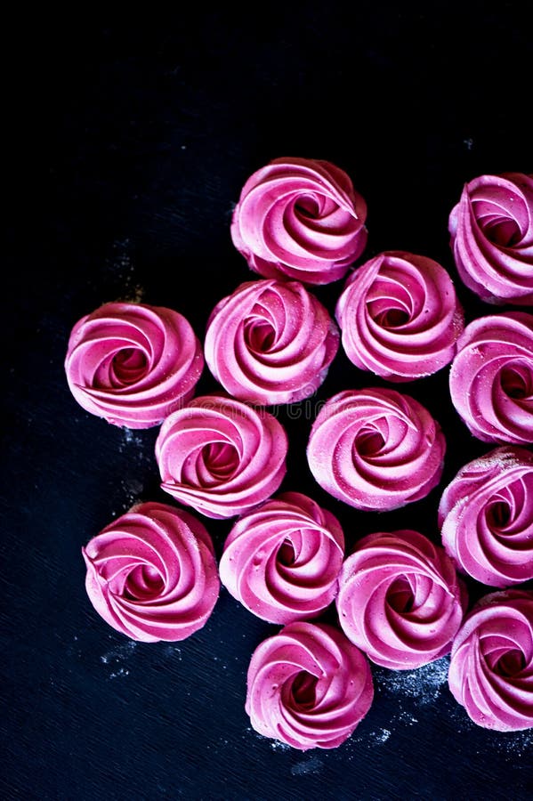 Many Purple Marshmallow on a Dark Surface. a Contrasting Picture. a ...