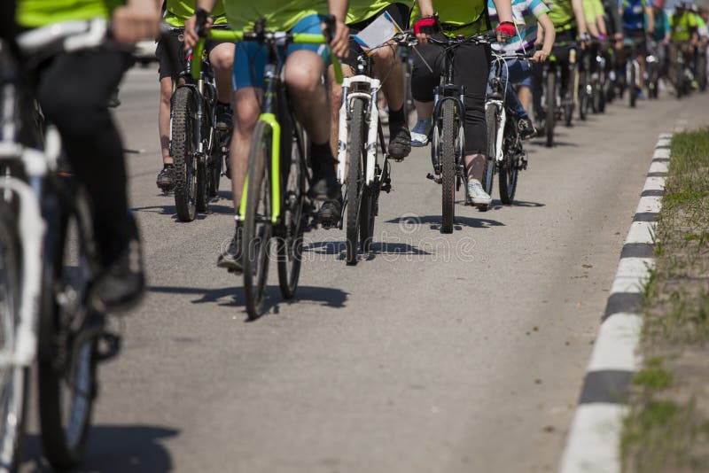 Many Racing Bikes. a Group of Cyclists Riding during the Street Stock ...
