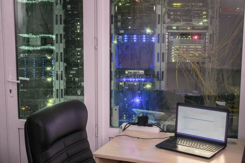 Many Racks with Computer Equipment are Behind the Glass Wall of a ...