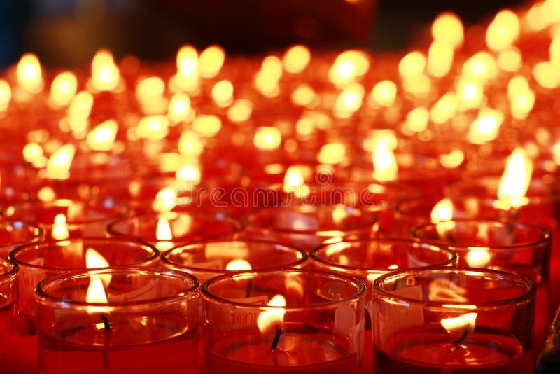 Many red candles burning stock image. Image of candlelight - 64400607