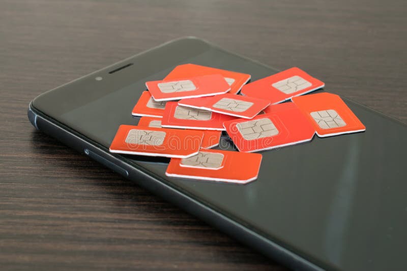 Many Red SIM Cards are on Top of the Black Screen of the Smartphone ...