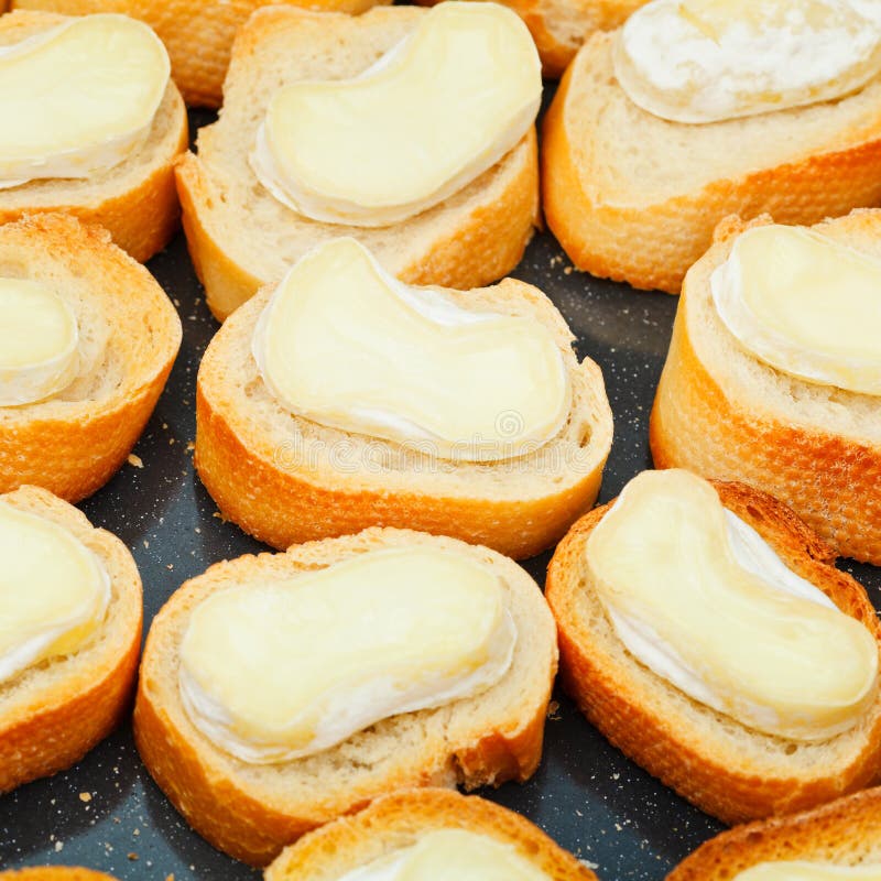 Many Roasted Pieces of Bread with Melted Goat Cheese Stock Photo ...