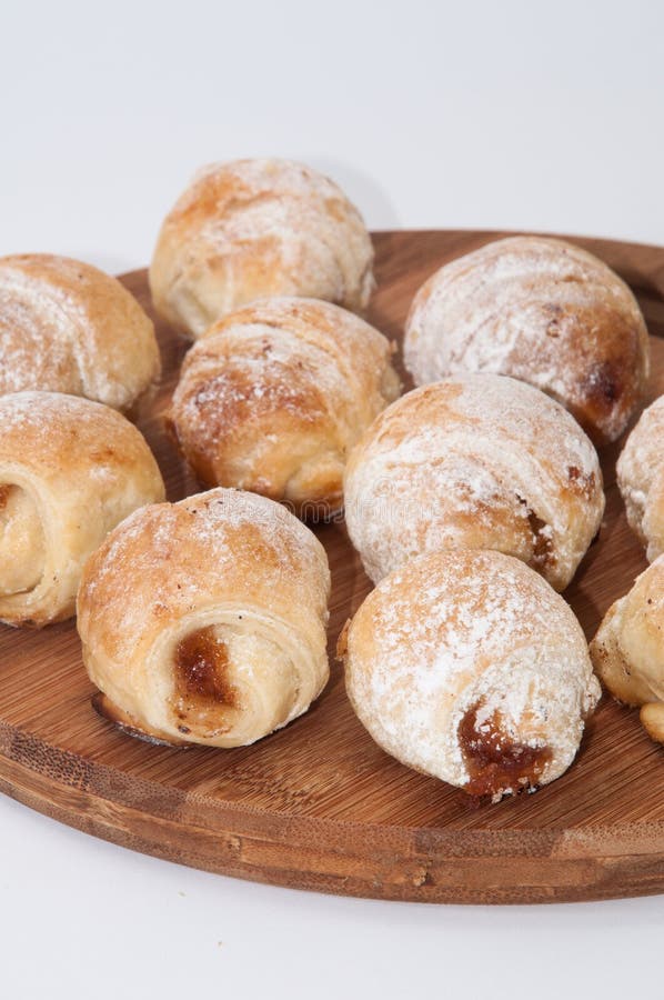 Many Rolls with Jam and Sprinkled with Powder Sugar on a Kitchen Stock ...