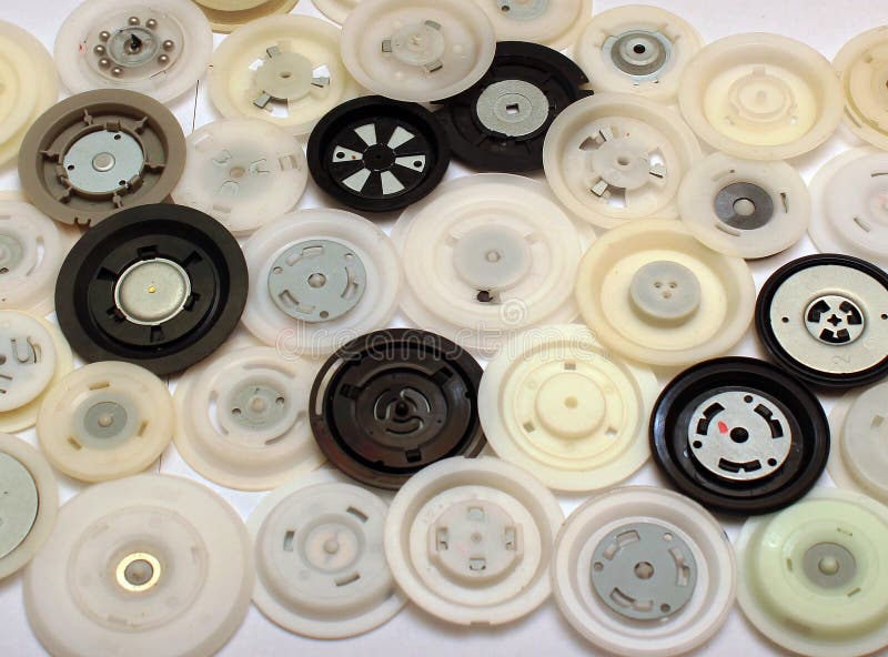 Many Round Plastic Clamps from Cd and Dvd Disc Drives Stock Image ...