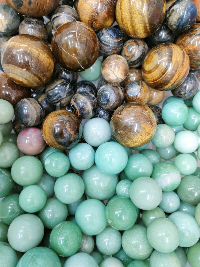 Many Round Semi-precious Stones of Green and Brown Color Stock Photo ...