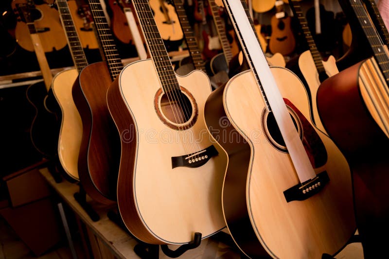 Many Rows of Classical Guitars in the Music Shop Stock Image - Image of ...