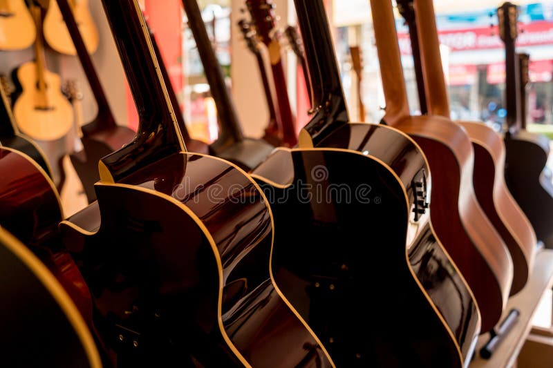 Many Rows of Classical Guitars in the Music Shop Stock Image - Image of ...