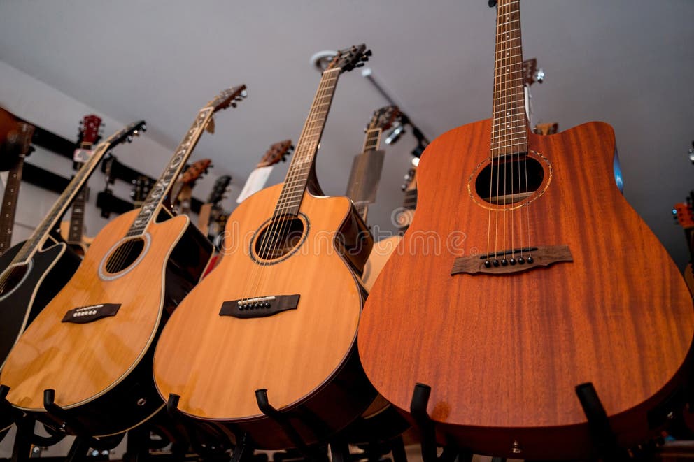 Many Rows of Classical Guitars in the Music Shop Stock Image - Image of ...