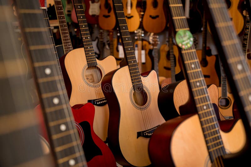 Many Rows of Classical Guitars in the Music Shop Stock Image - Image of ...