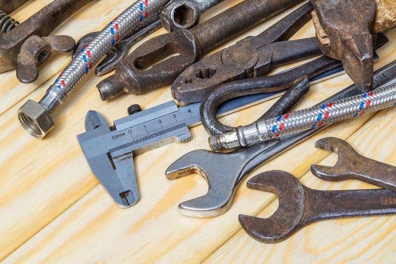 Old Tools Stacked after Work on Vintage Wood Background Stock Image ...