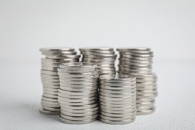 Many Silver Coins Stacked on White Table Stock Image - Image of stack ...