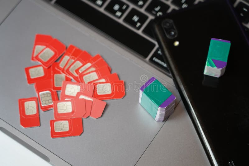 Many SIM Cards on a Laptop Keyboard. Bot Farm Stock Image - Image of ...
