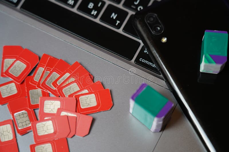 Many SIM Cards on a Laptop Keyboard. Bot Farm Stock Image - Image of ...