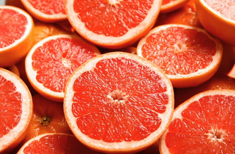 Many Sliced Fresh Ripe Grapefruits As Background Stock Image - Image of ...