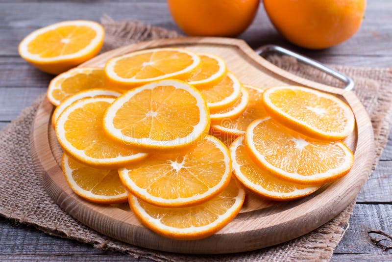 Many Slices of Fresh Orange on a Cutting Board Stock Image - Image of ...