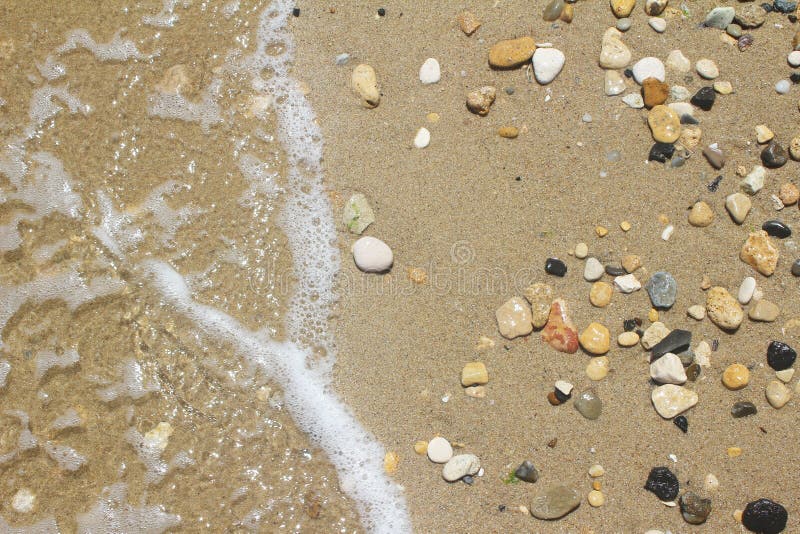Many Small Beautiful Stones on a Sandy Summer Beach. Stock Image ...