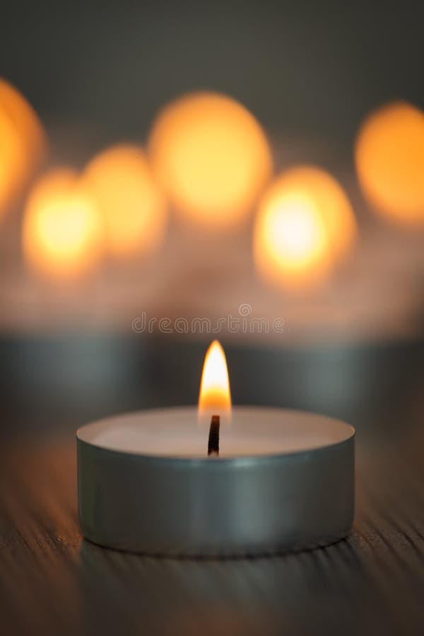 Many small burning candles stock image. Image of darkness - 103839099