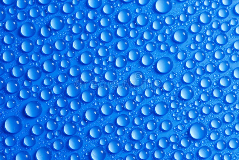 Small Water Drops on a Blue Surface Stock Photo - Image of glossy ...