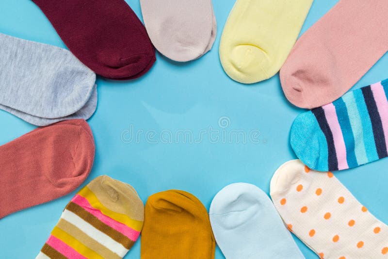 Many Socks are Piled in a Circle in Blue Background. View from Above ...