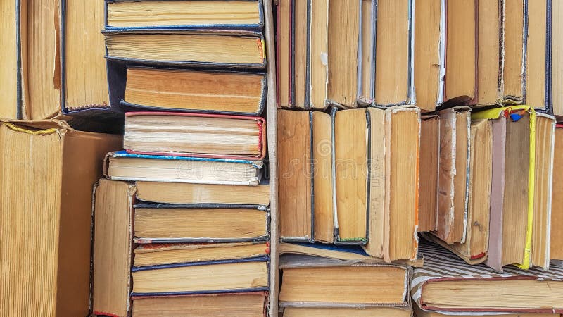 Many Sorted Old Books are Stacked As a Background Front View. Stack of ...