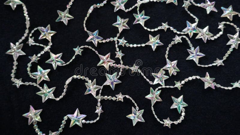 Many Sparkling, Shimmering Star Chains for Christmas, on Black ...