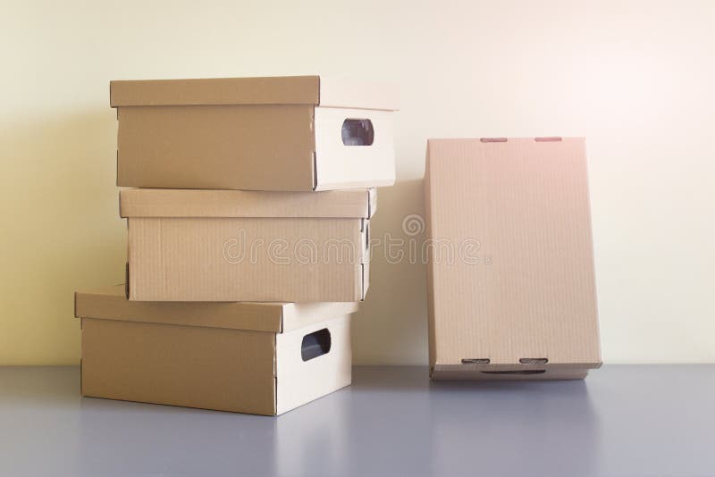 Stacked Brown Carton Boxes Laying on Table Stock Image - Image of blank ...
