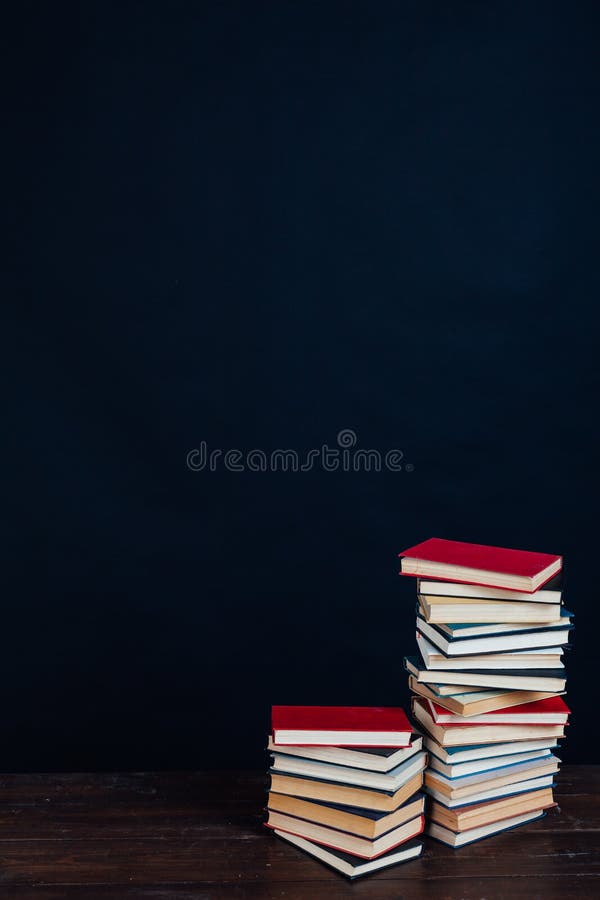 Many Stacks of Educational Books in the University Library on a Black ...
