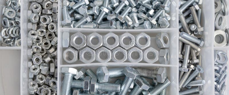 Many Steel Nuts and Bolts in a White Plastic Box Stock Photo - Image of ...