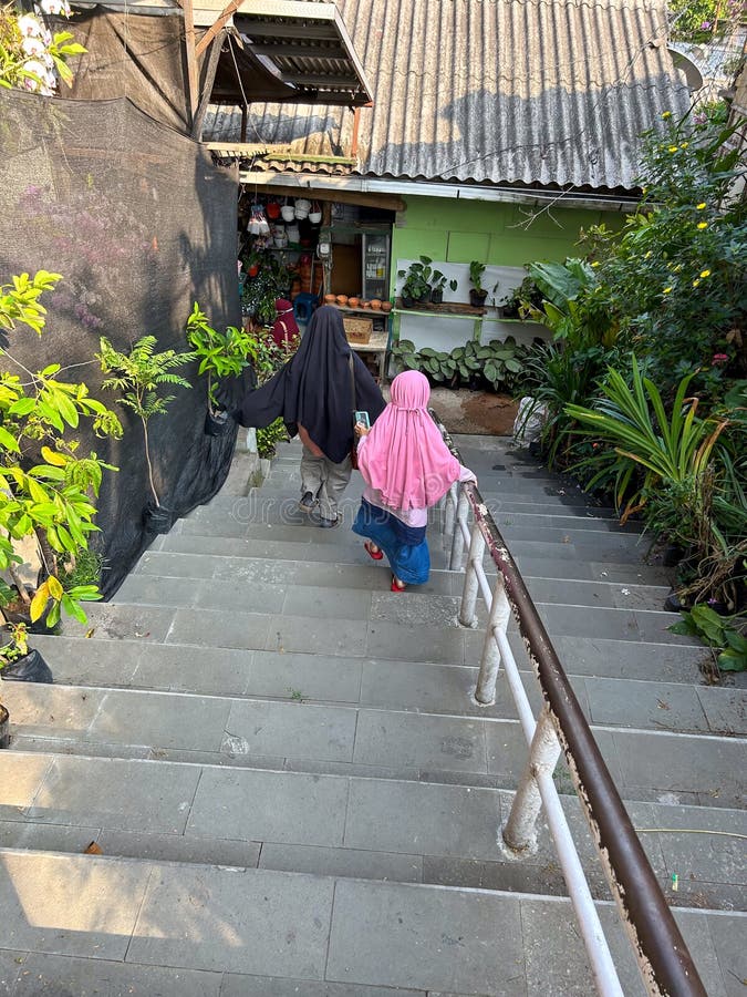 So Many Steps with Iron Railings in the Middle and Two People Walking ...