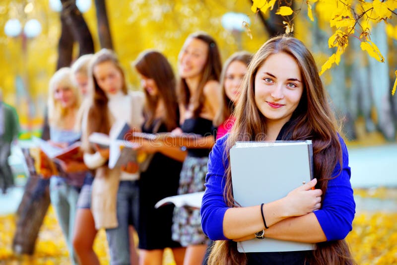 Many Students in the Autumn Park Stock Image - Image of young, folder ...