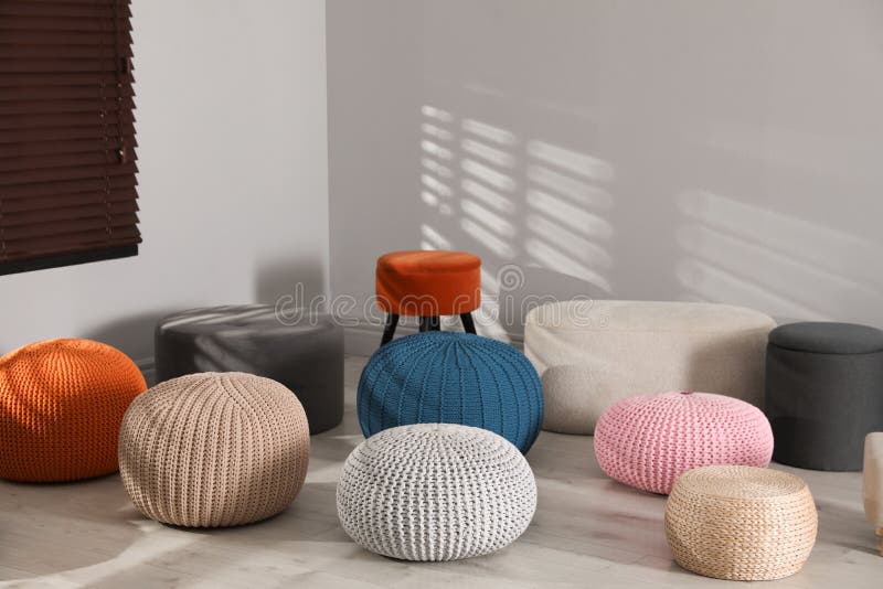 Many Stylish Different Poufs in Room. Home Design Stock Photo - Image ...