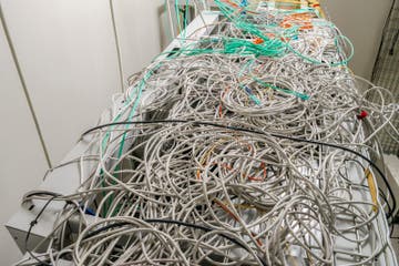 Many Tangled Wires are on Top of the Server Racks of the Data Center ...