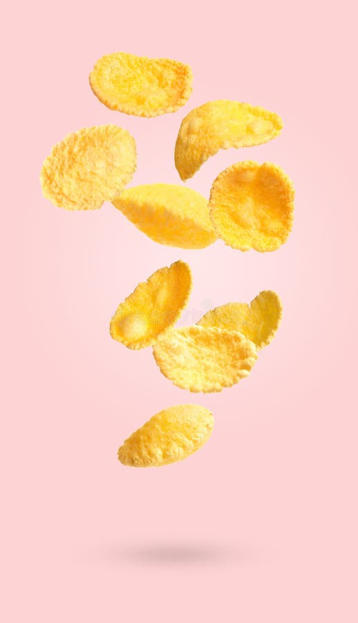 Many Tasty Corn Flakes Falling on Pink Background Stock Photo - Image ...