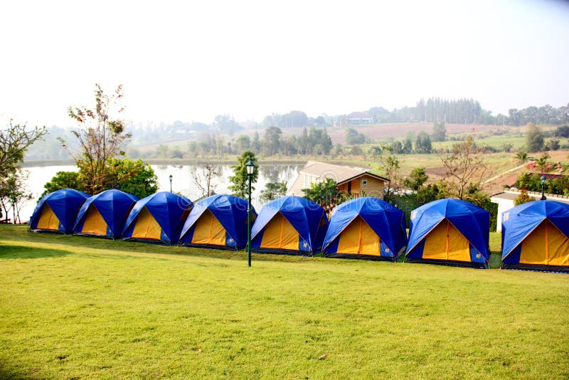 Many Tents on green grass stock image. Image of gray - 25557099