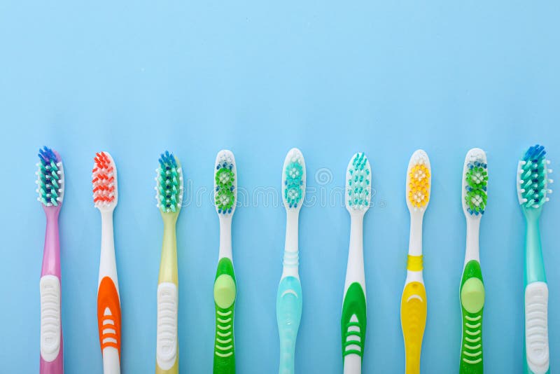 Many Tooth Brushes on Color Background Stock Photo - Image of brushes ...