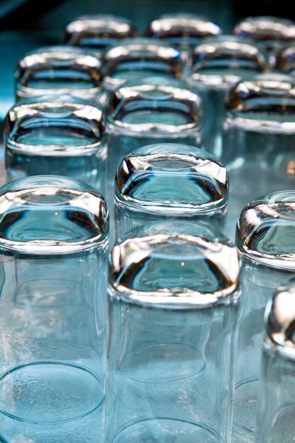 Many Transparent Glasses on Blue Background Stock Image - Image of ...