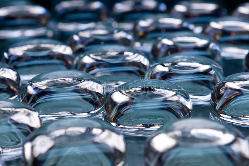 Many Transparent Glasses on Blue Background Stock Photo - Image of blue ...