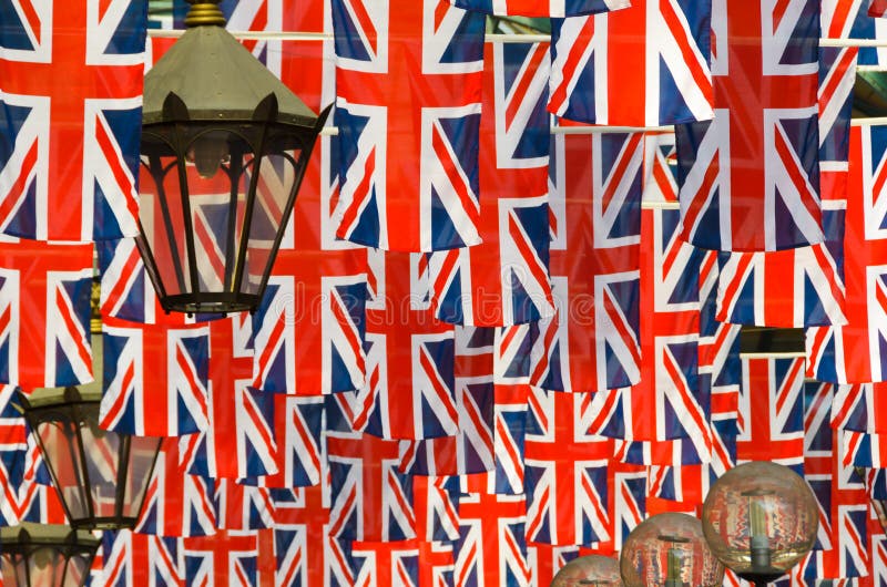Many Union Jack Flags Hanging Vertically among Light Fixtures Stock ...