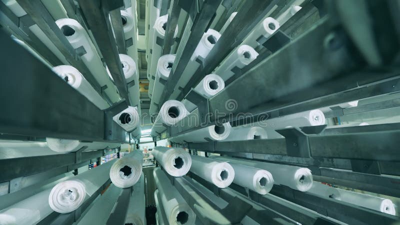 Many White Paper Rolls Moving Vertically during the Production Process ...