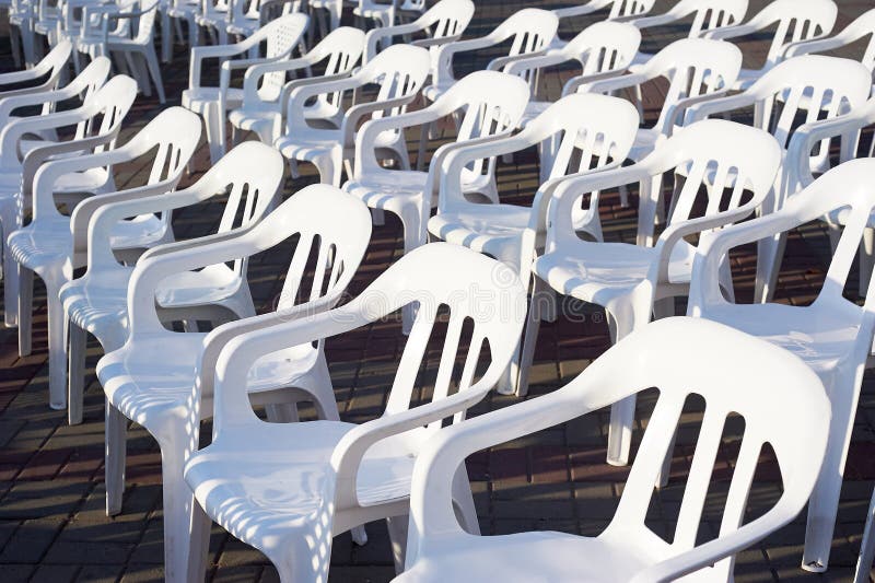 Many White Plastic Chairs, Exposed on a Sunny Day Outdoors,for the ...