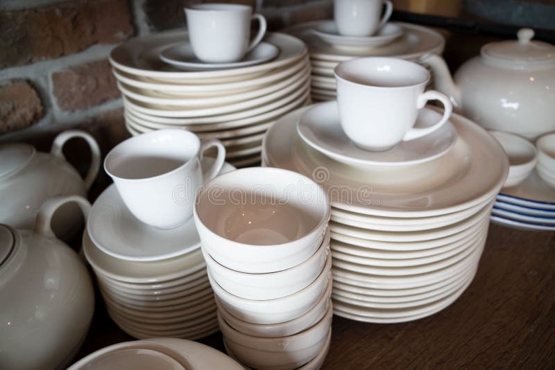 Many White Plates are Stacked Together.a Stack of White Dish Stock ...