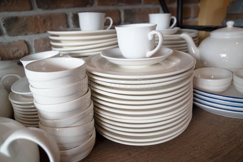 Many White Plates are Stacked Together.a Stack of White Dish Stock ...